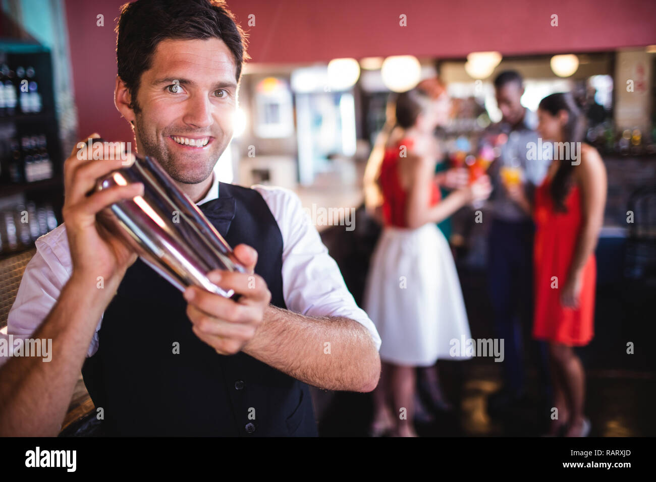 Man holding cocktail mixer hi-res stock photography and images - Alamy