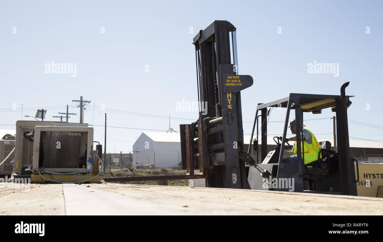 Scott Figueroa, Qualified Recycling Program assistant, maneuvers scrap ...