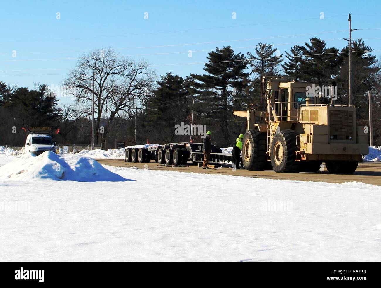 Workers prepare to load a trailer Feb. 8, 2017, near at the loading ...
