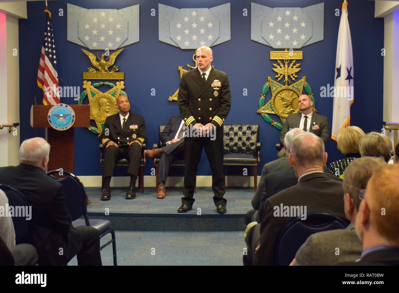 Cmdr. Michael Adams retires during a ceremony attended by family ...