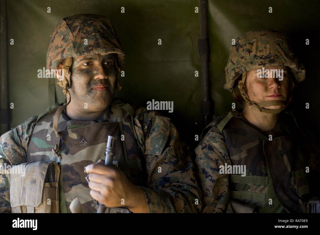 U.S. Marine Corps Lance Cpl. Fernando Rayon, left, an adminstrative ...