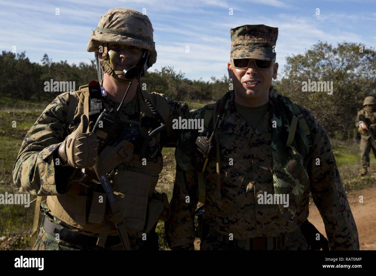 U.S. Marine Corps Maj. Jonathan C. Cartrett, left, commanding officer ...
