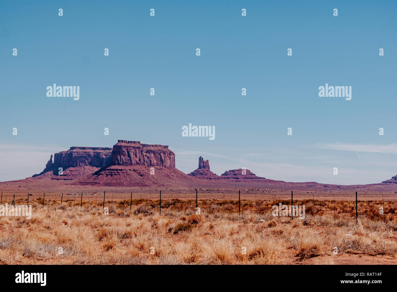 Red sandstone towering buttes known as Monument Valley on the Arizona ...