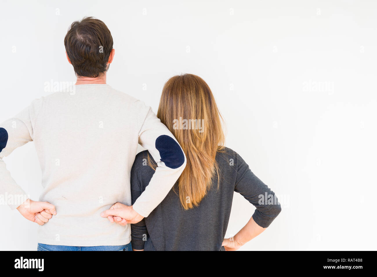Beautiful middle age couple in love over isolated background standing ...