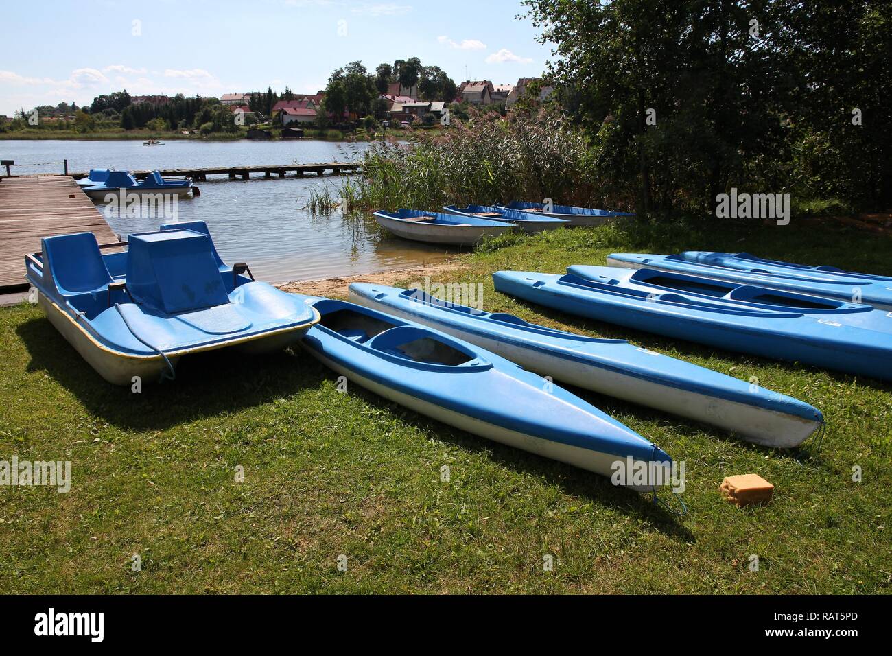 Masuria (Mazury) - famous lake district in Poland. Blue paddle boat ...