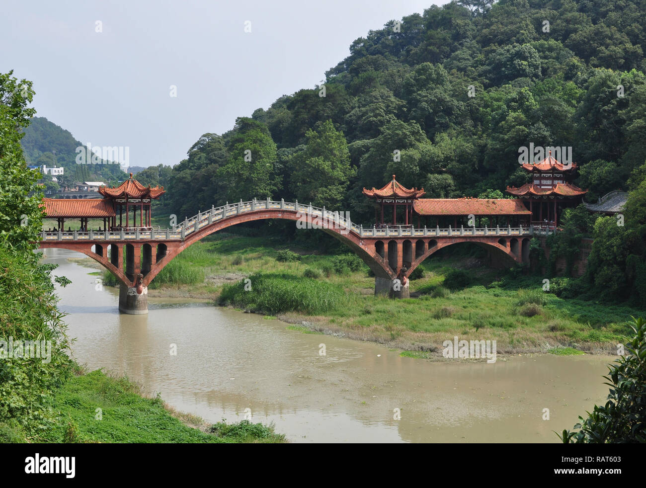 Traditional arched bridge over river Stock Photo - Alamy