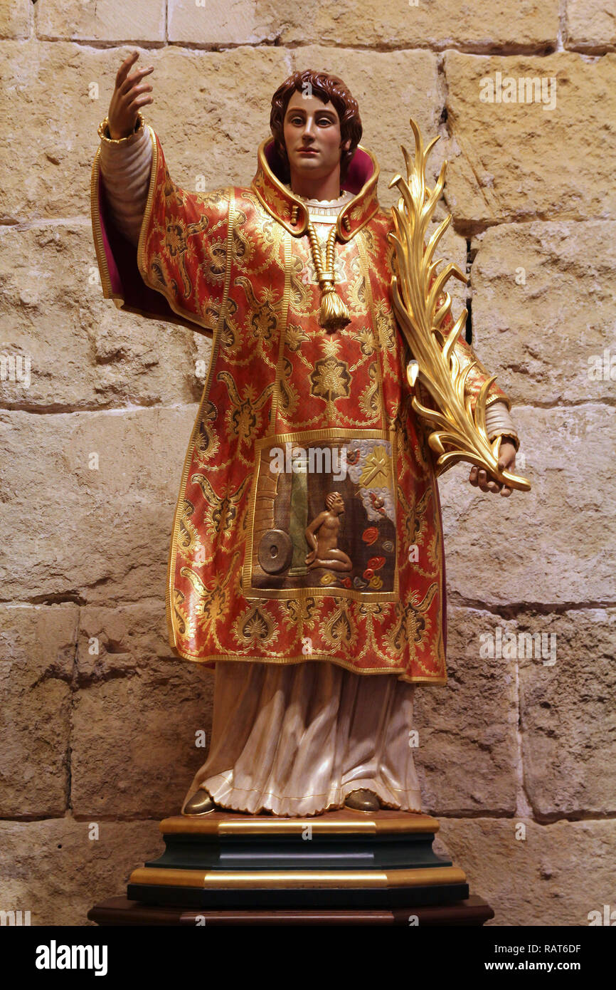 Saint Vincent statue in Cordoba, Spain. The Great Mosque (currently ...