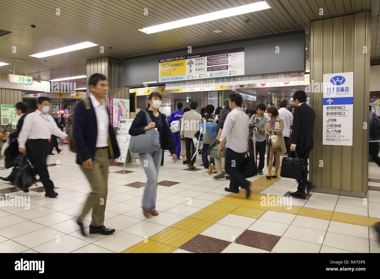 TOKYO, JAPAN - MAY 9, 2012: People enter Tokyo Metro station. With more ...