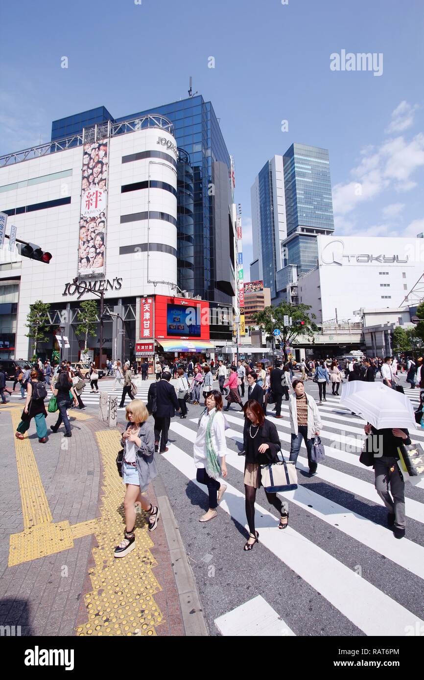 TOKYO, JAPAN - MAY 11, 2012: People walk the Hachiko crossing in ...
