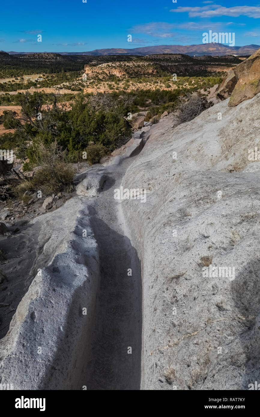 Trail cut into soft volcanic tuff rock by footwear through the years ...