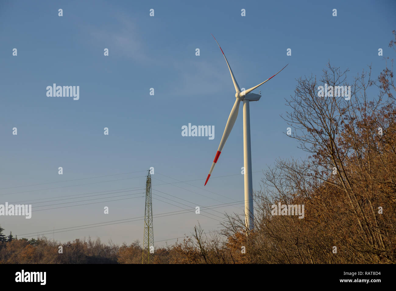 Wind turbine on blue sky. Production of clean and renewable energy ...