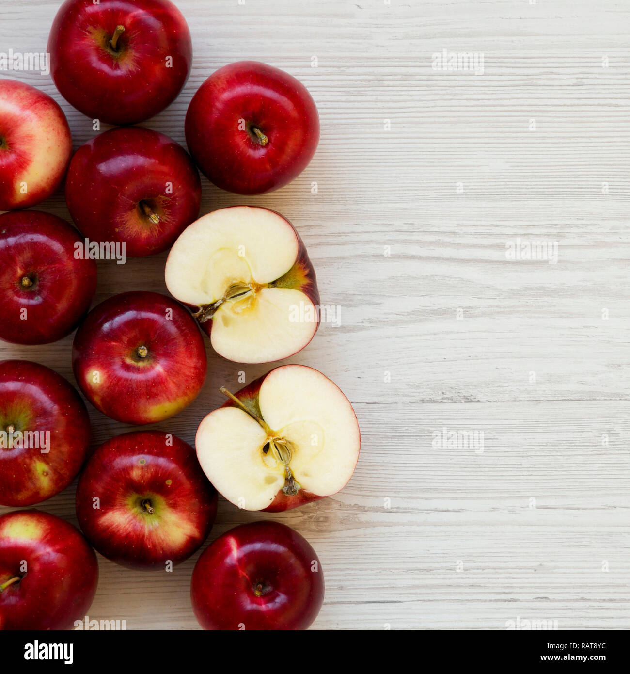 Raw red apples on white wooden background, overhead view. Flat lay ...