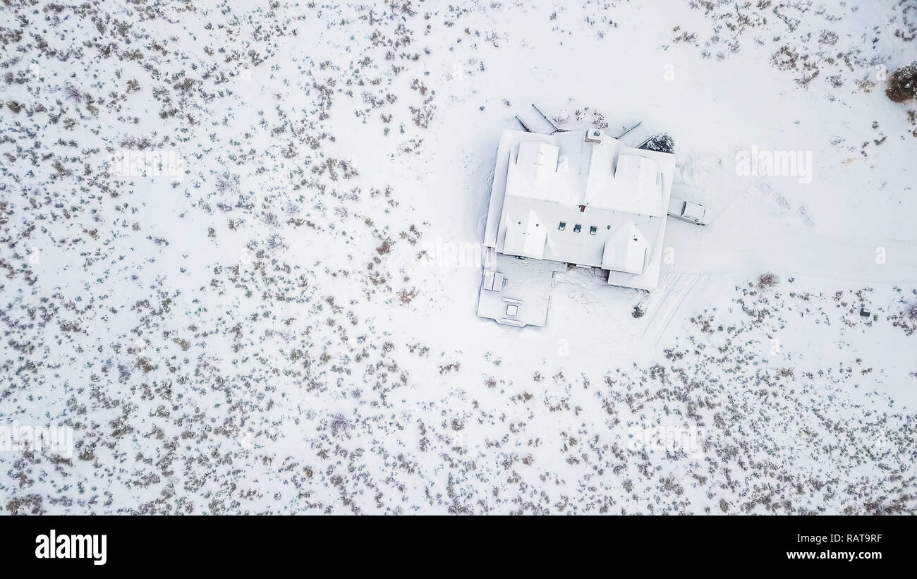 Aerial view of the mountain house covered in snow in the Winter Stock ...