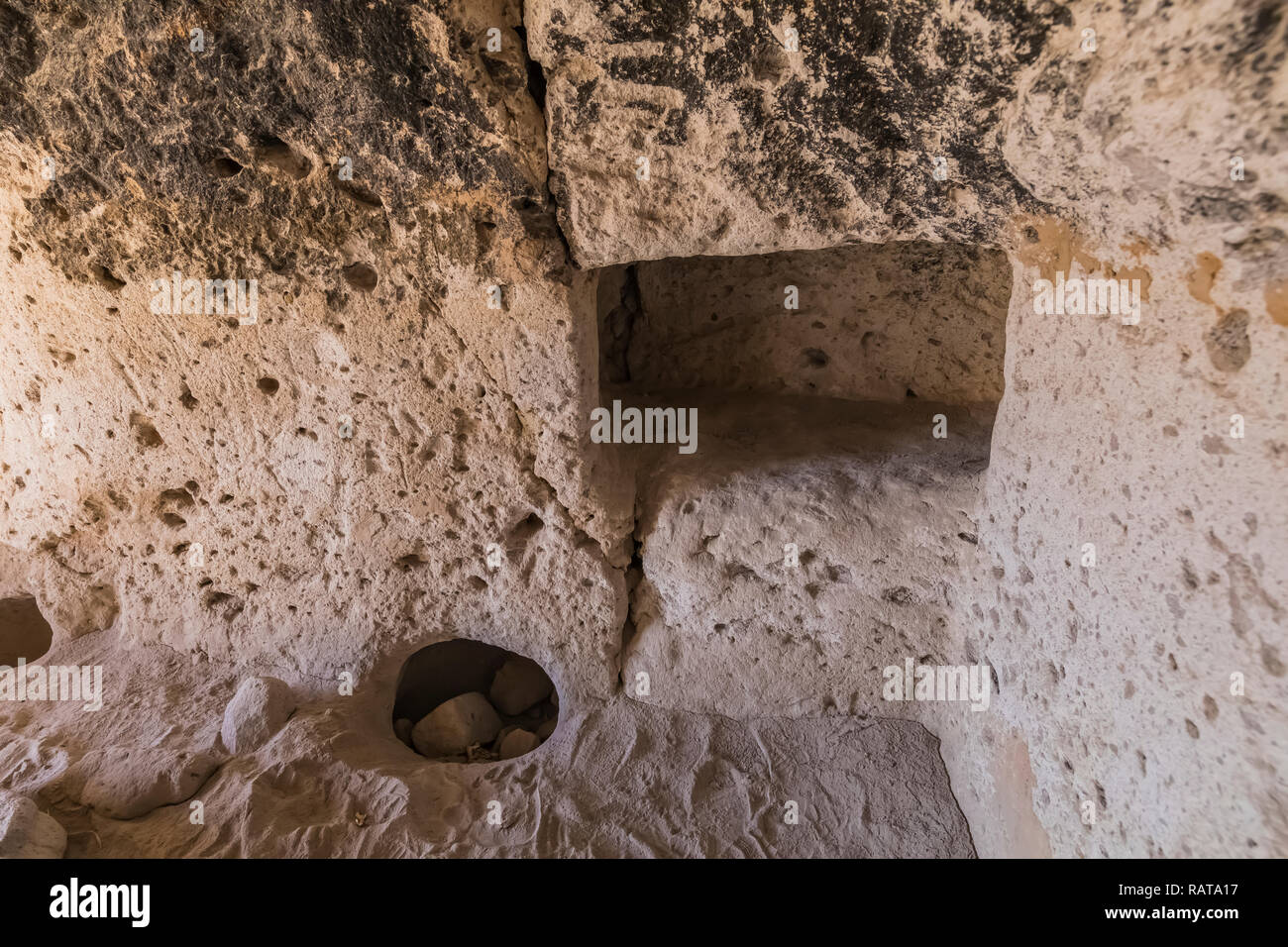 Storage nook in cavate (room) carved from soft tuff rock, with ...