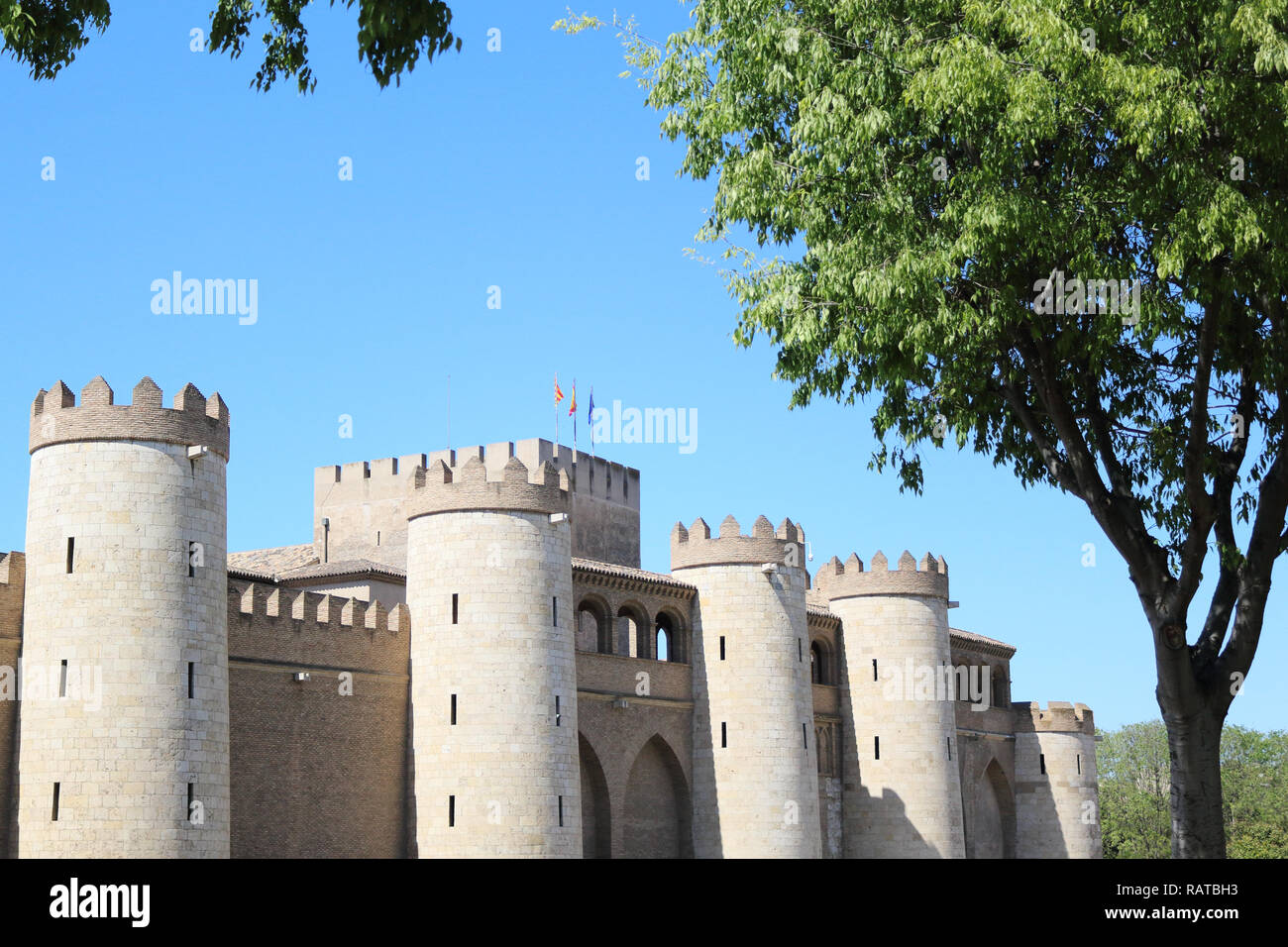 The facade with towers and walls of the Islamic Aljaferia fortress, a ...