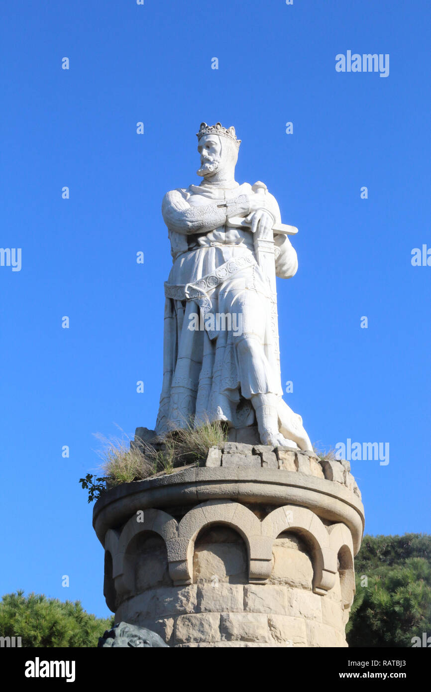 The concrete white statue of Alfonso the Battler, king of Aragon ...