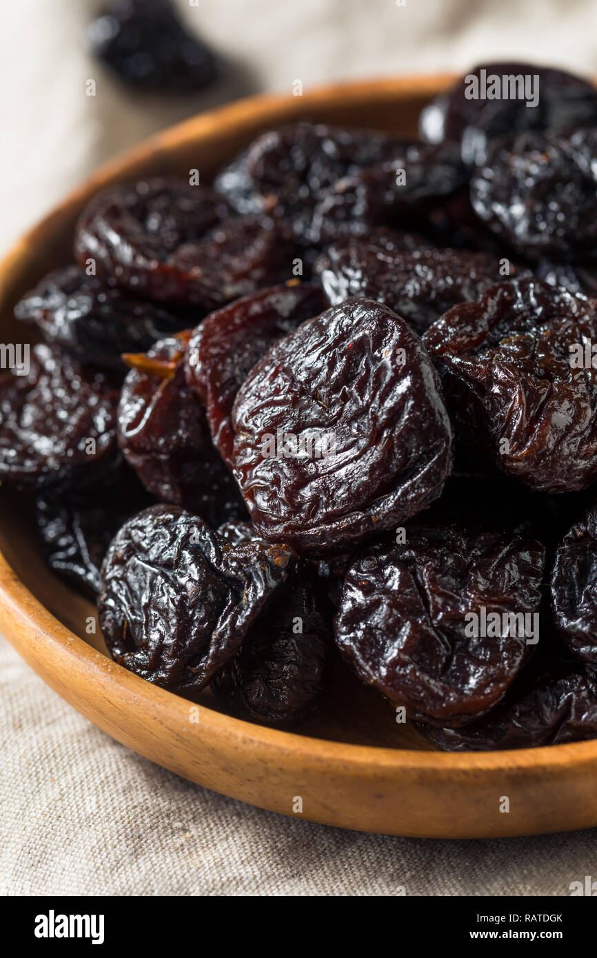 Raw Organic Dry Prunes in a Bowl Stock Photo - Alamy