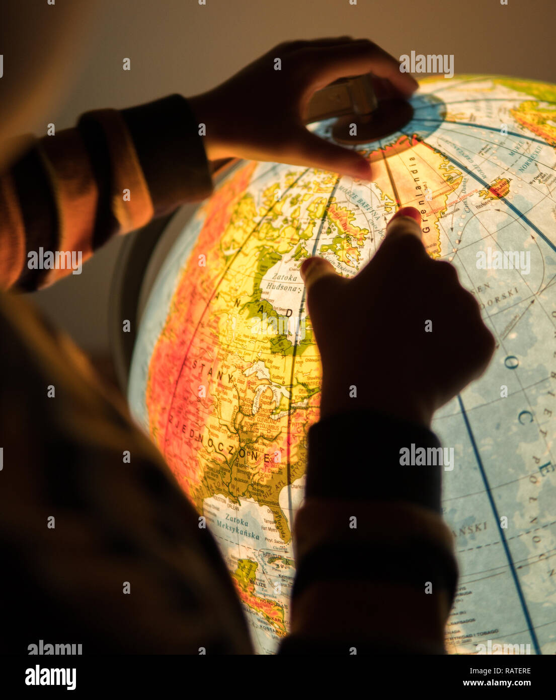 looking for a location on an earth model map Stock Photo - Alamy