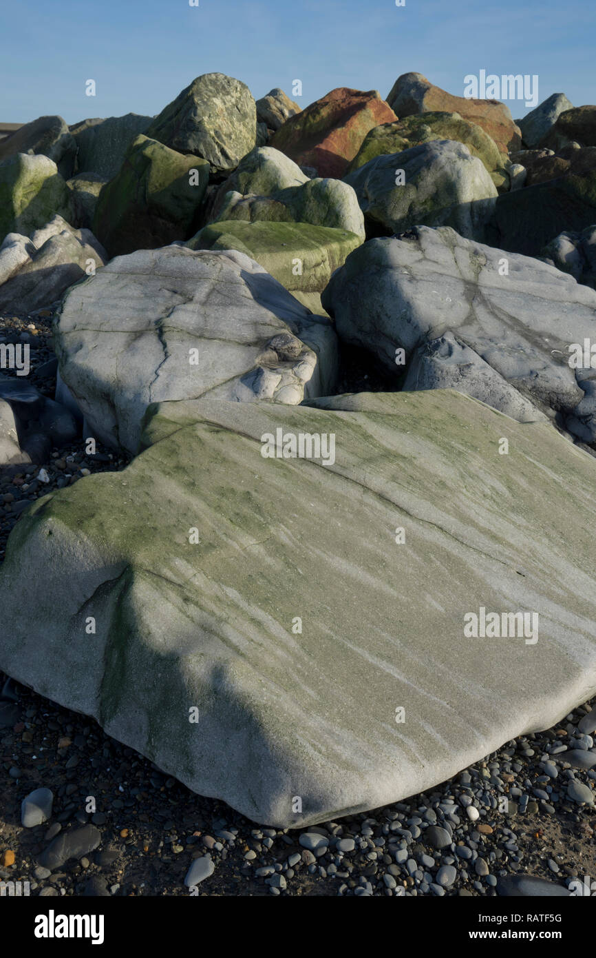 Rocks at the beach at the seaside resort of Borth on Cardigan Bay near ...