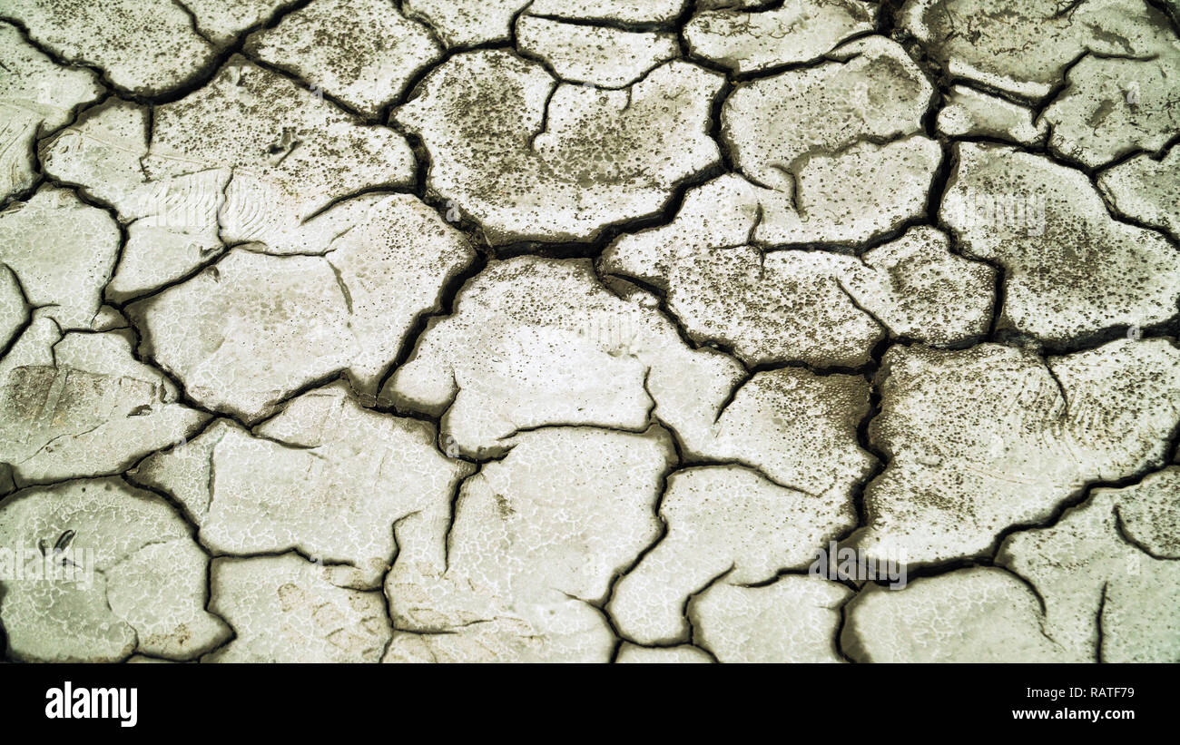 Dry cracked soil, Arid climate. Volcanic landscape around volcano ...