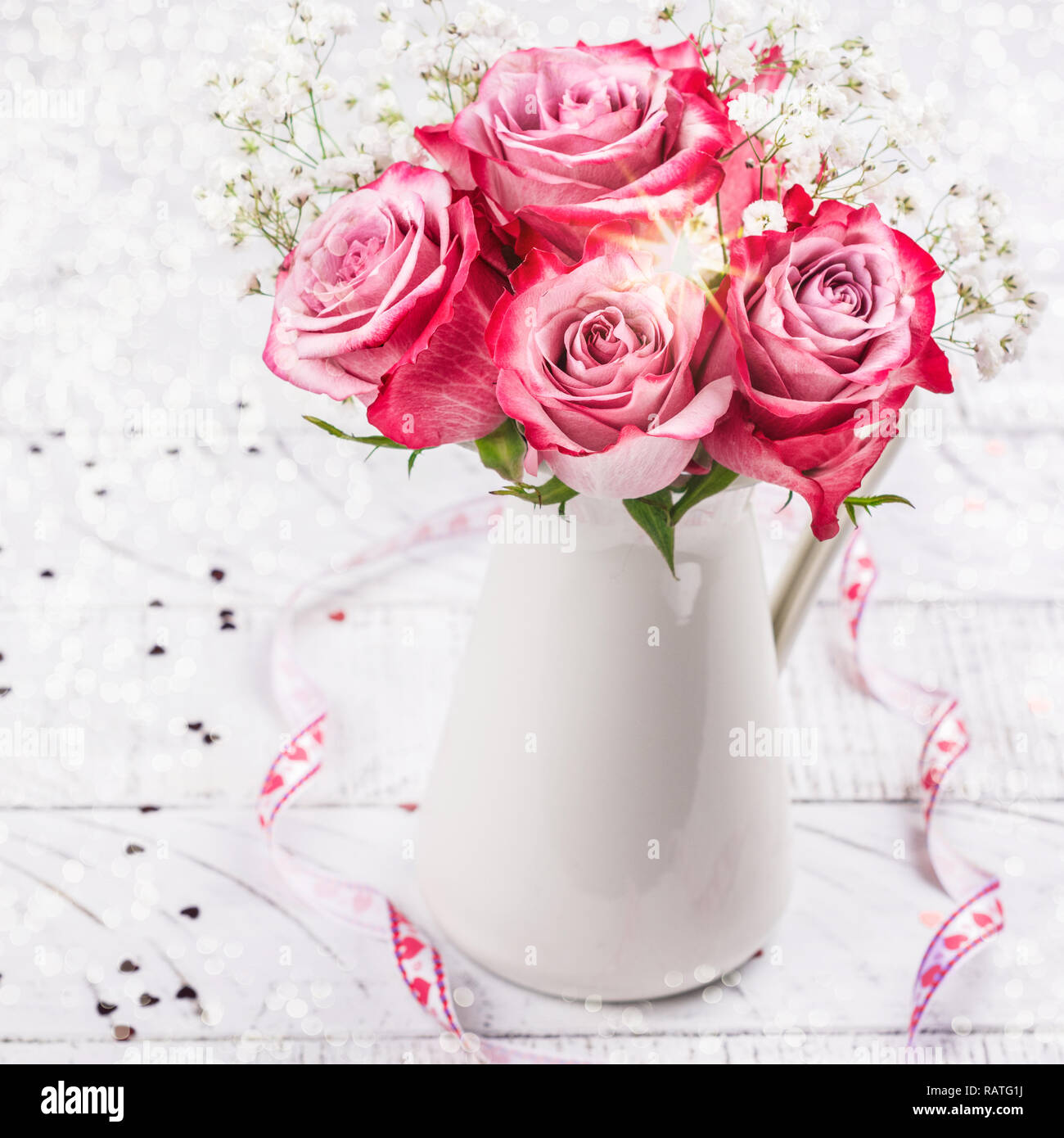 Bouquet rose vase white ribbon hi-res stock photography and images - Alamy