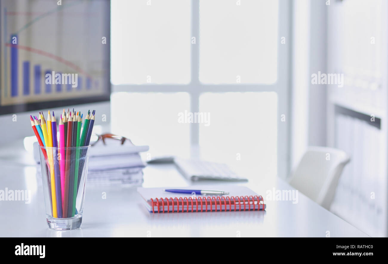Office table with blank notepad and laptop Stock Photo - Alamy