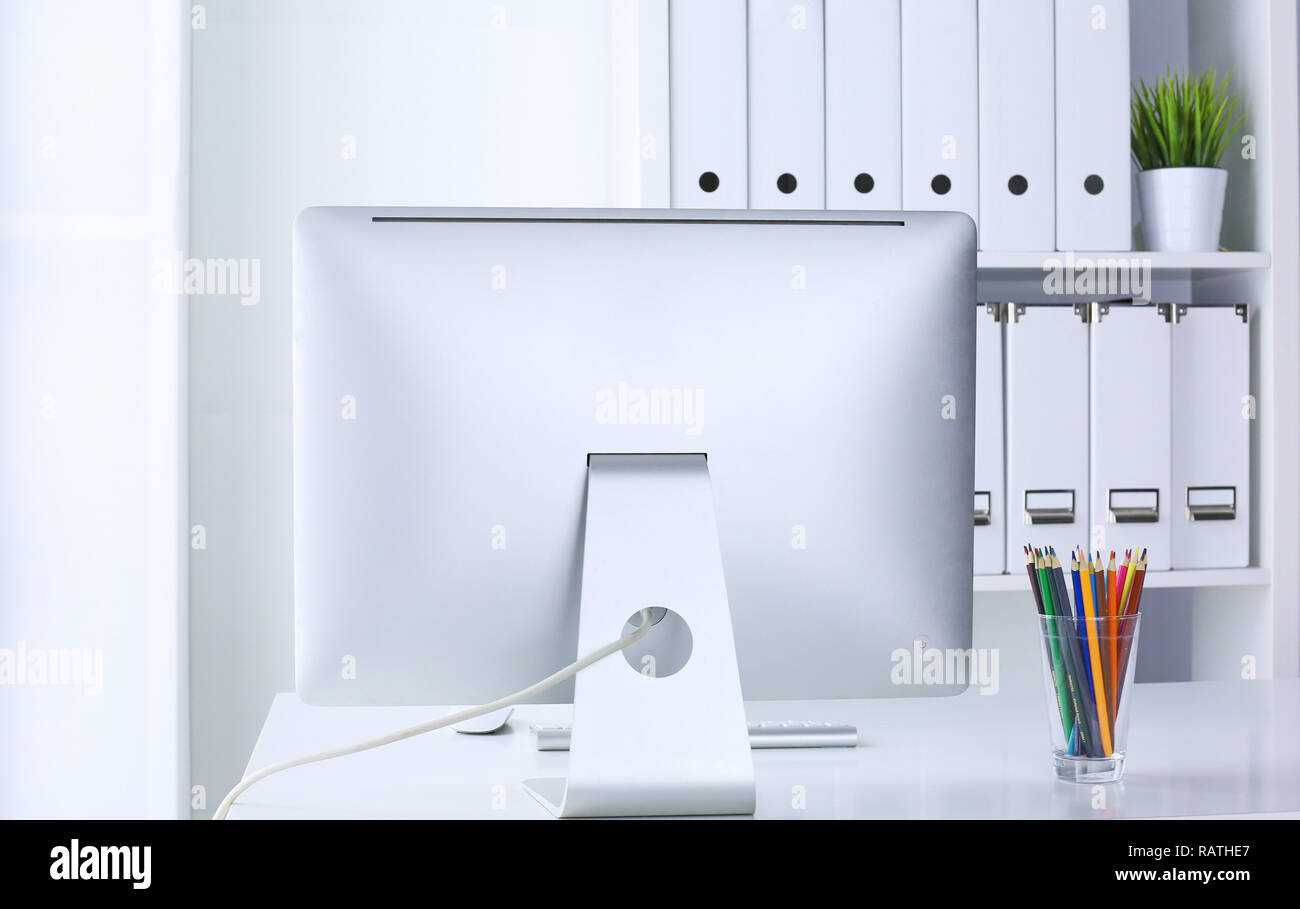 Office table with blank notepad and laptop Stock Photo - Alamy