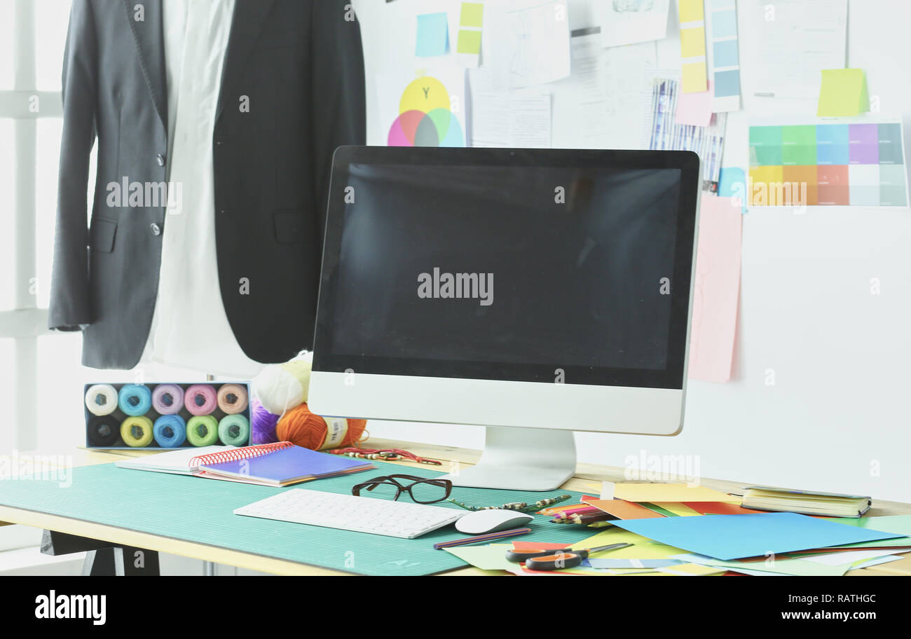 Empty workroom and workplace of tailor or vendor of clothes in small ...