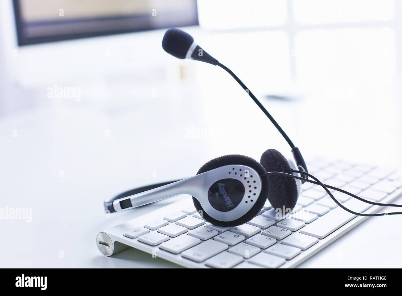 Call center and customer service help desk. VOIP headset on laptop ...