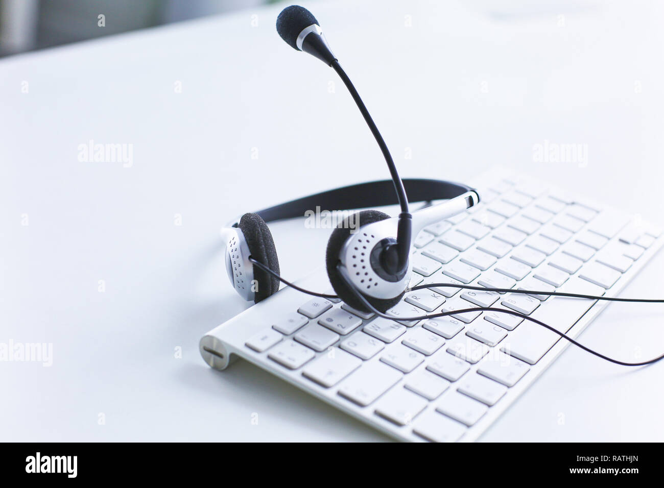 Call center and customer service help desk. VOIP headset on laptop ...