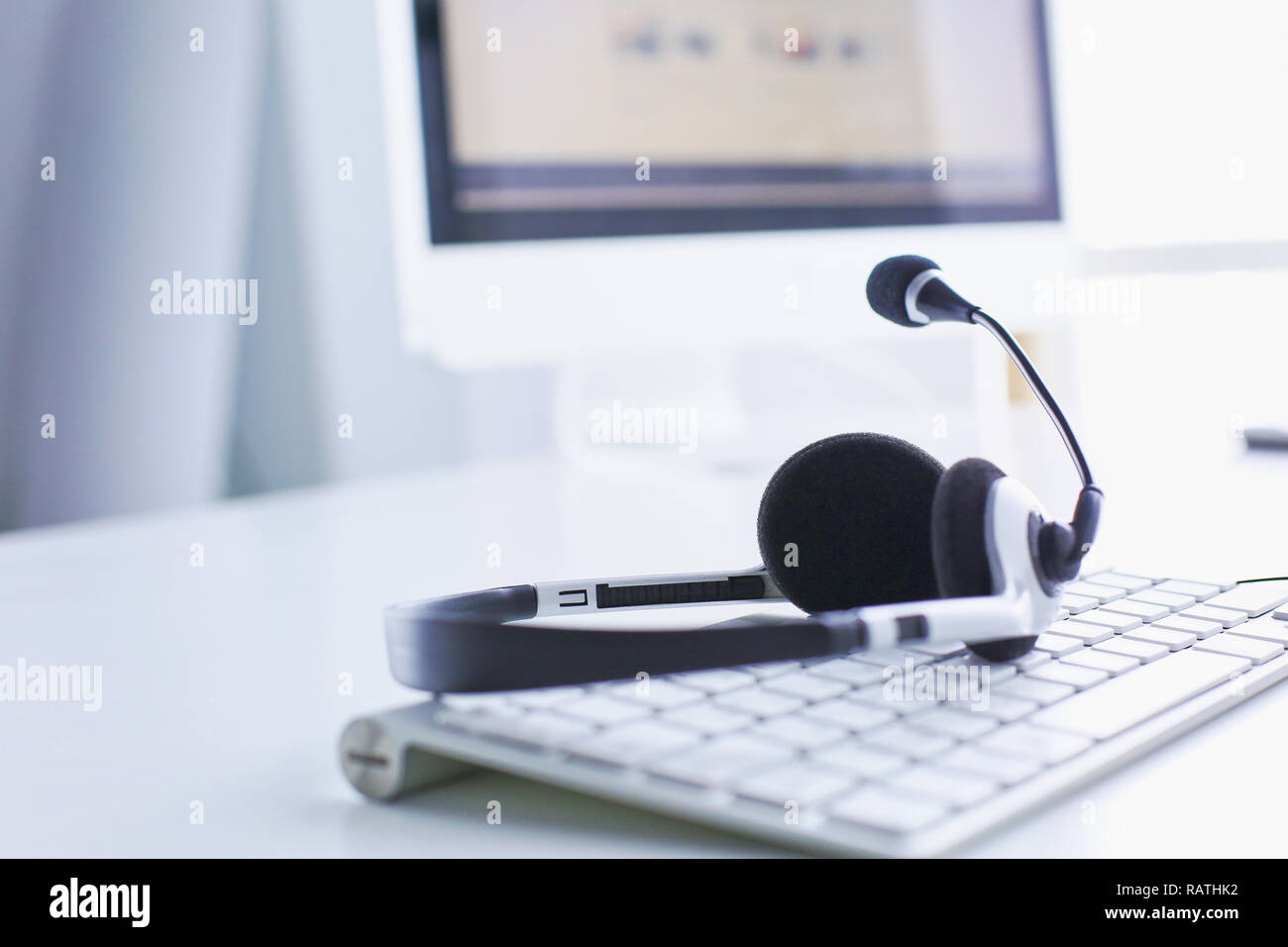 Call center and customer service help desk. VOIP headset on laptop ...