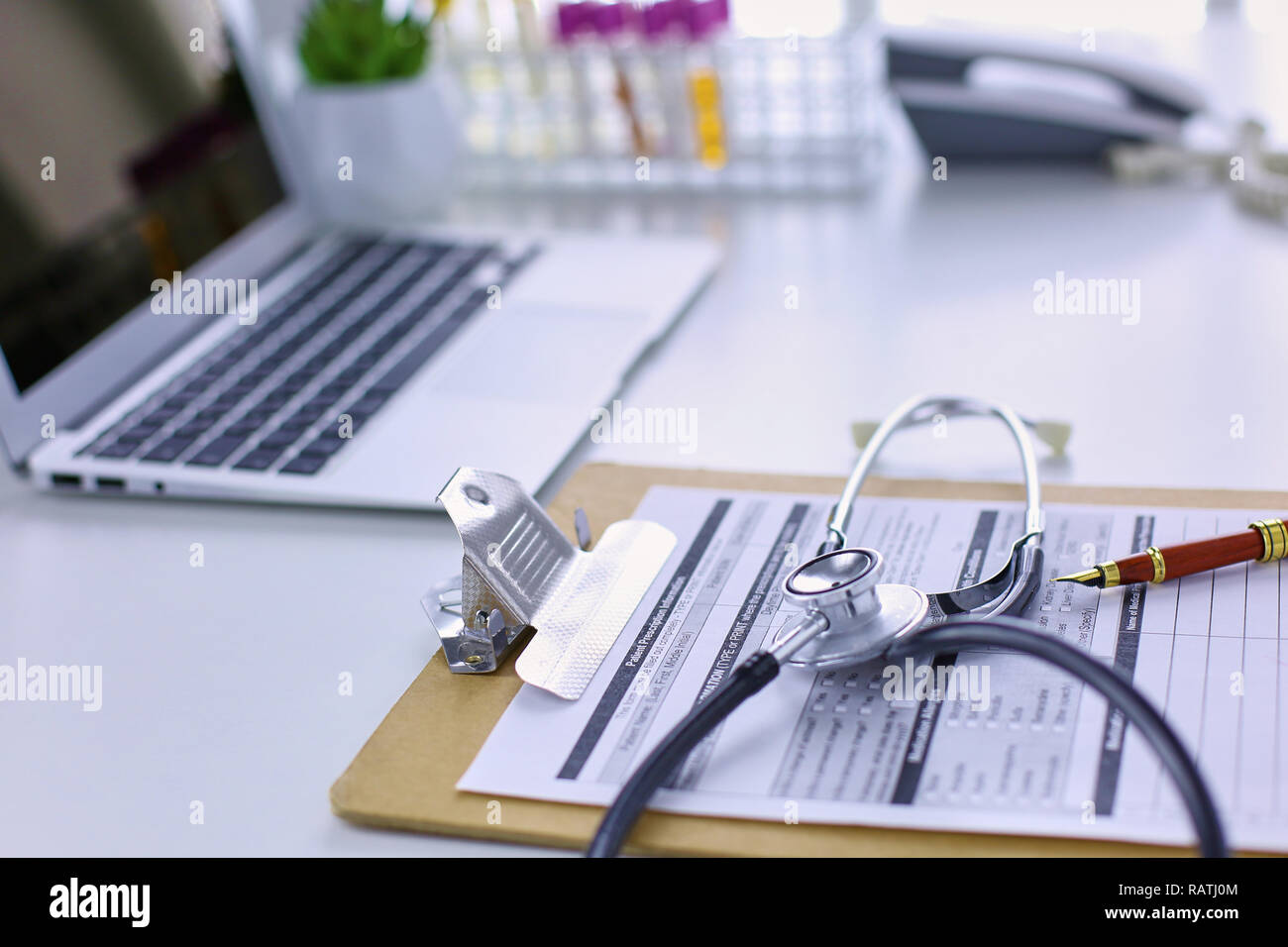 Doctor's workspace working table with patient's discharge blank paper ...