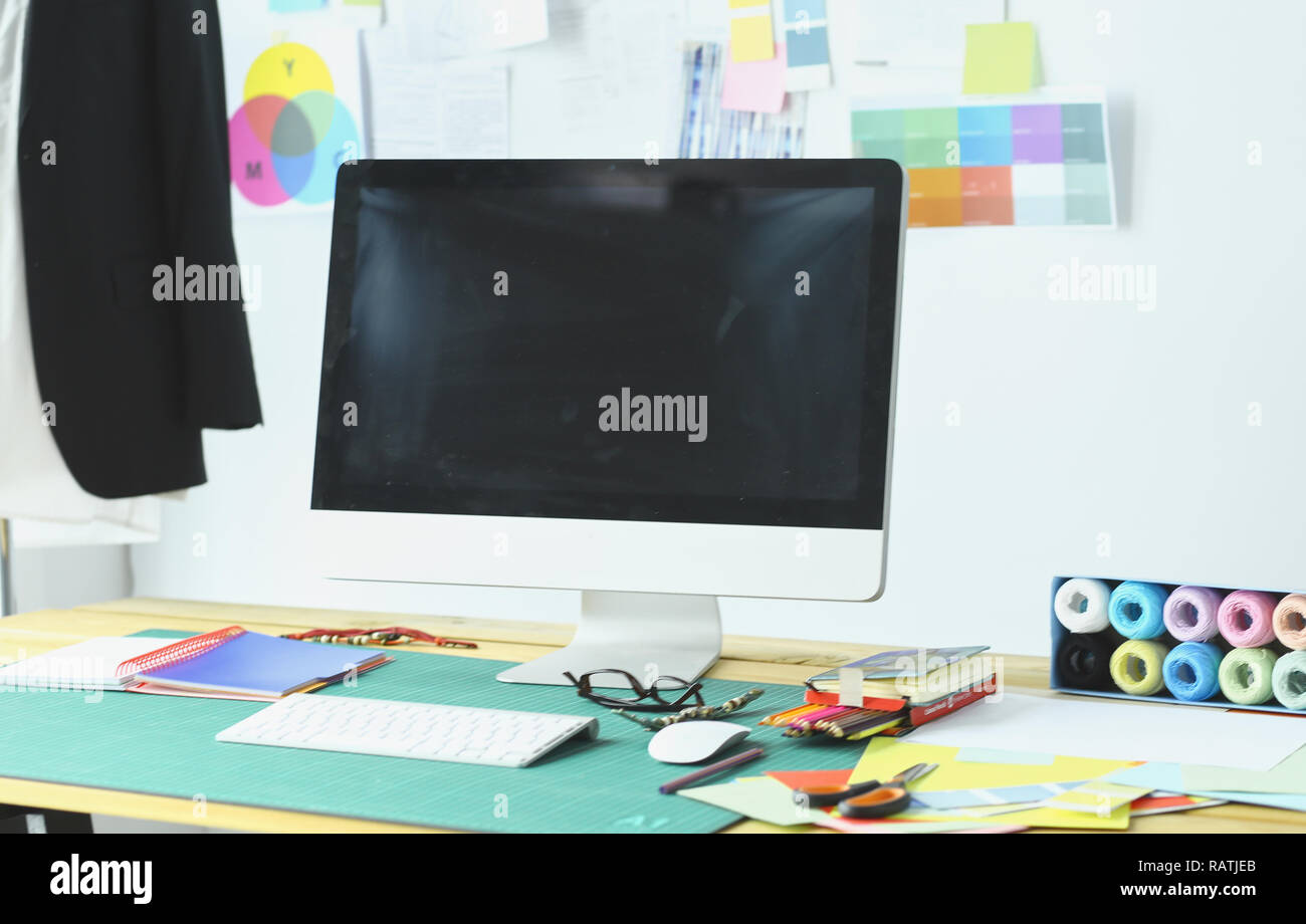 Empty workroom and workplace of tailor or vendor of clothes in small ...