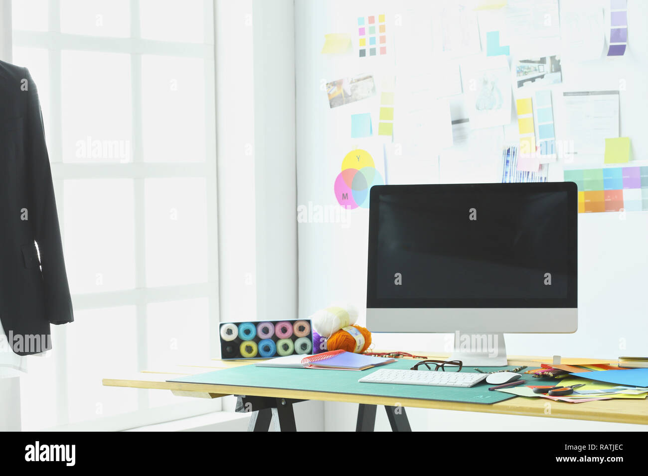 Empty workroom and workplace of tailor or vendor of clothes in small ...