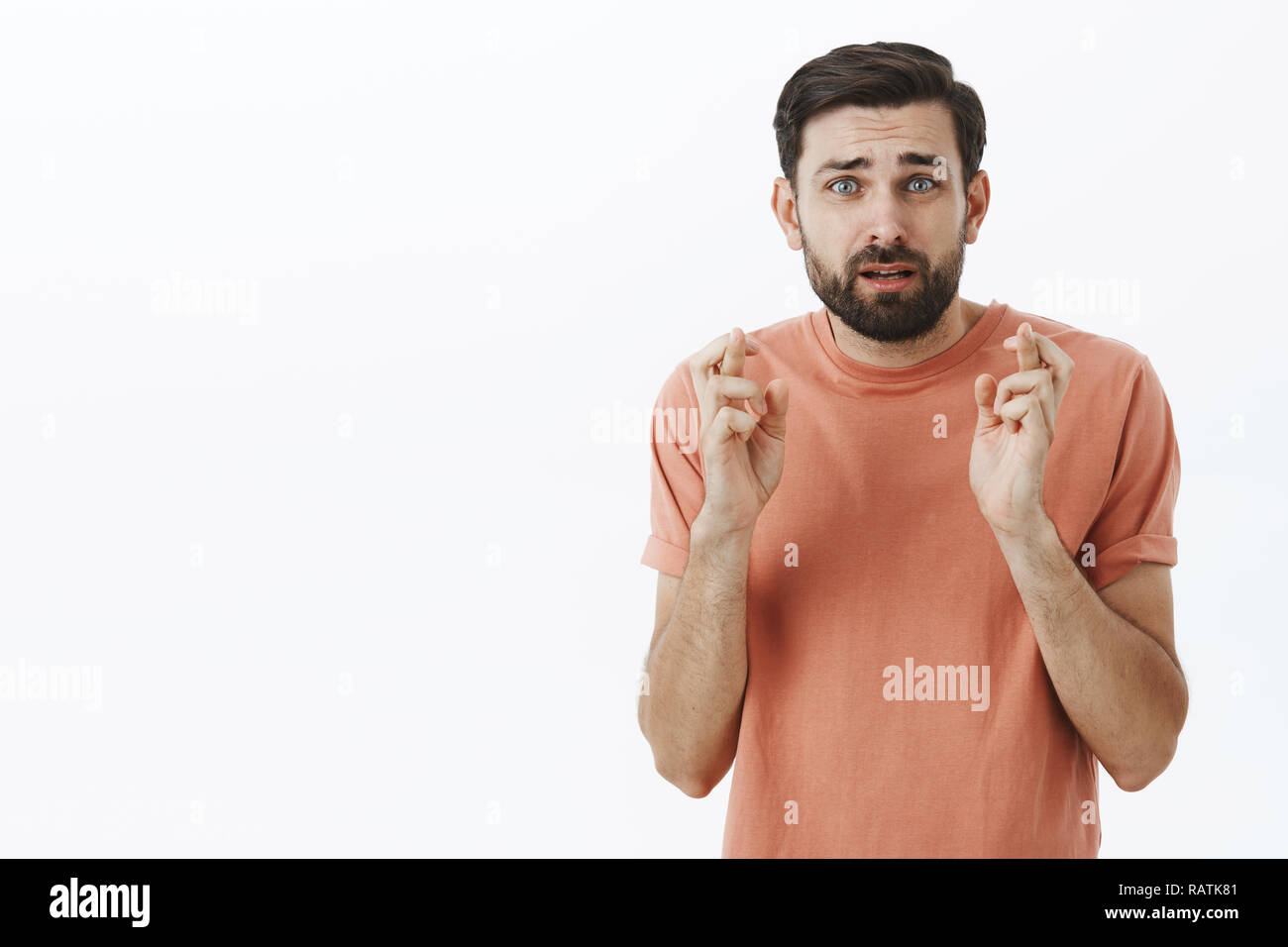 Unconfident insecure and anxious clumsy bearded man raising crossed ...