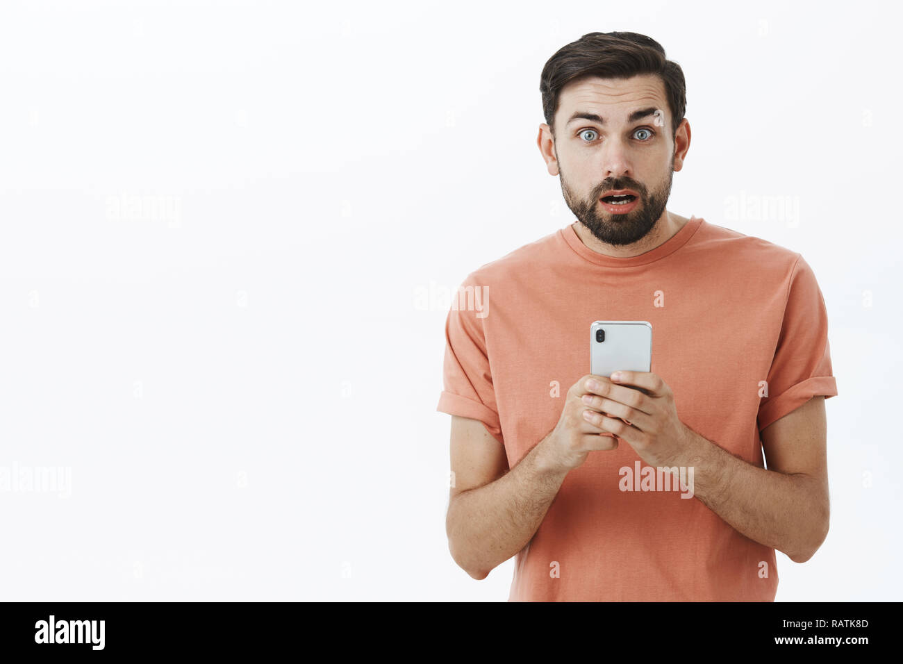 Shocked guy receiving text hi-res stock photography and images - Alamy
