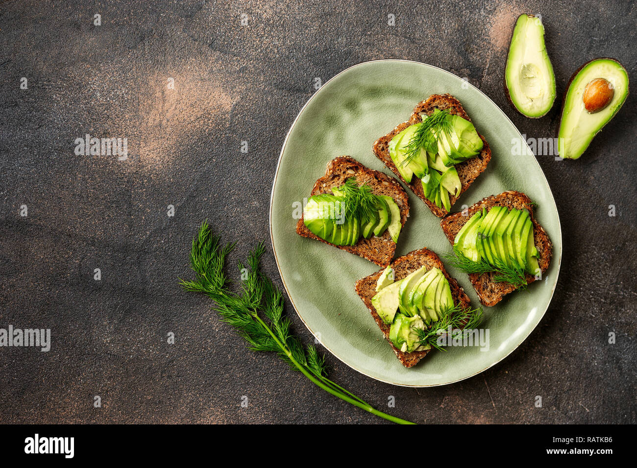 Top view of avocado toasts in a plate Stock Photo - Alamy