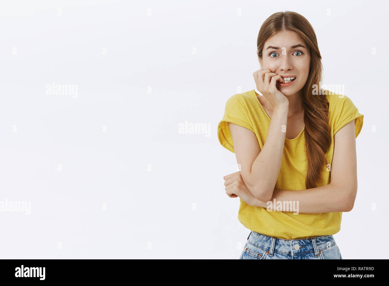 Concerned panicking timid and insecure attractive young woman in casual ...