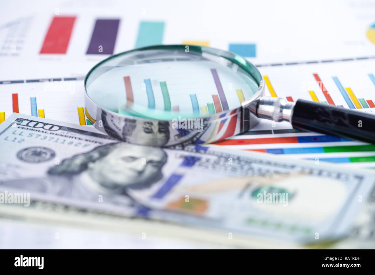 Magnifying glass on bar chart hi-res stock photography and images - Alamy