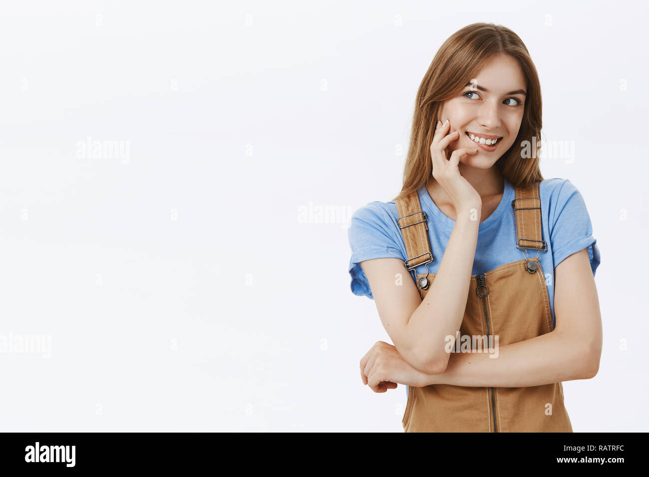 Waist-up shot of charming tender pretty feminine woman in brown ...
