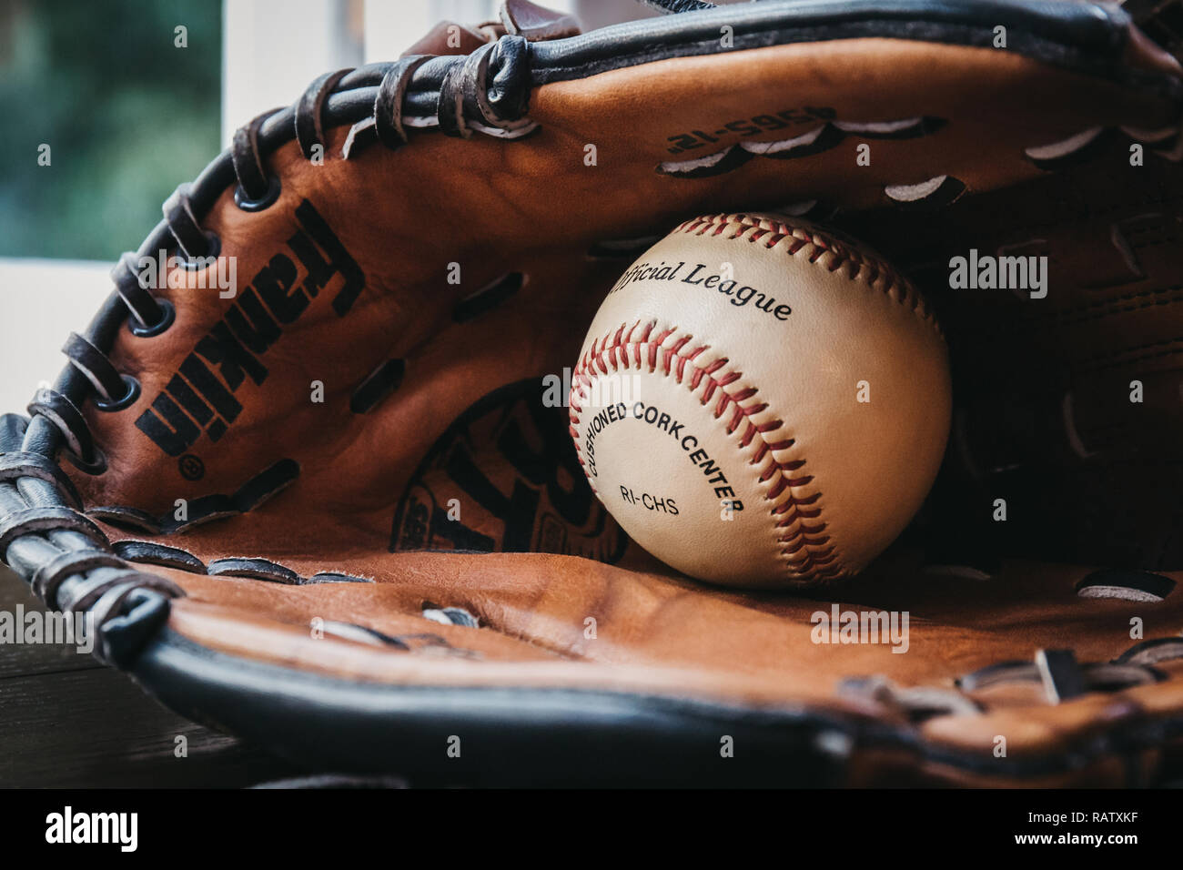 London, UK - January 3, 2019: Close up of a white baseball ball inside ...