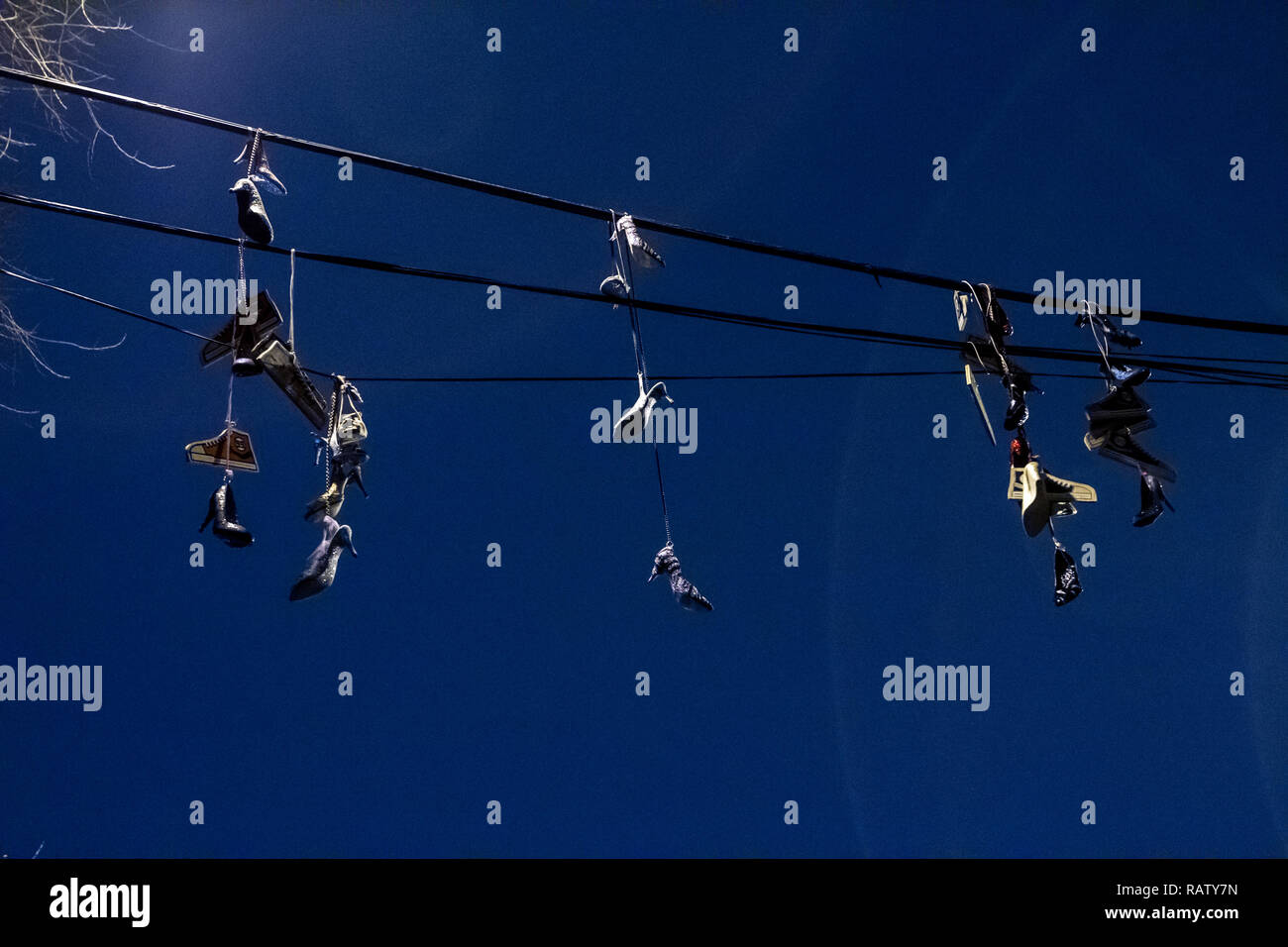 Shoes on telephone line hi-res stock photography and images - Alamy