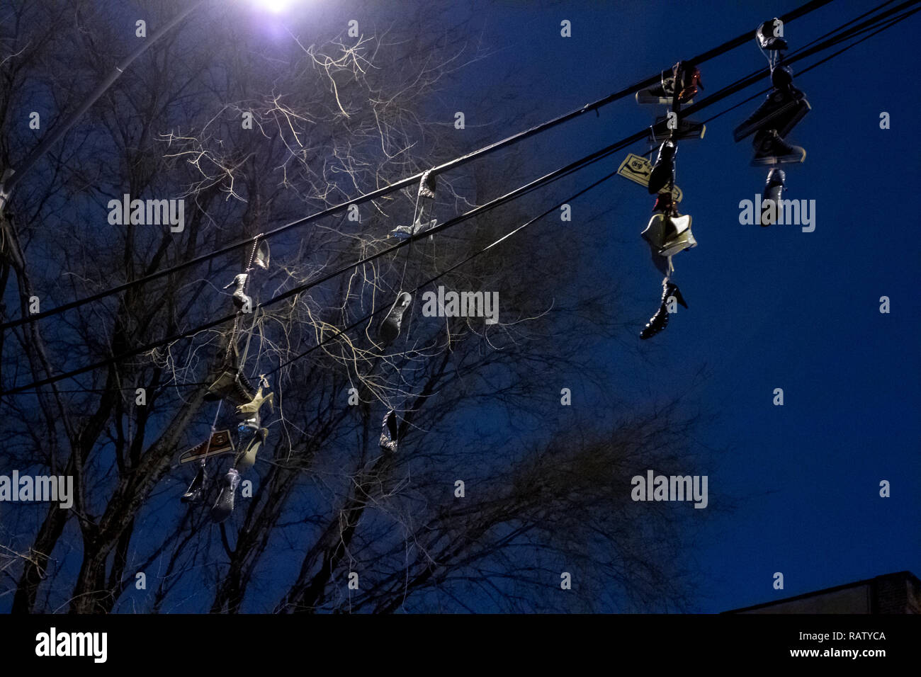 Sneakers hanging telephone wire hi-res stock photography and images - Alamy