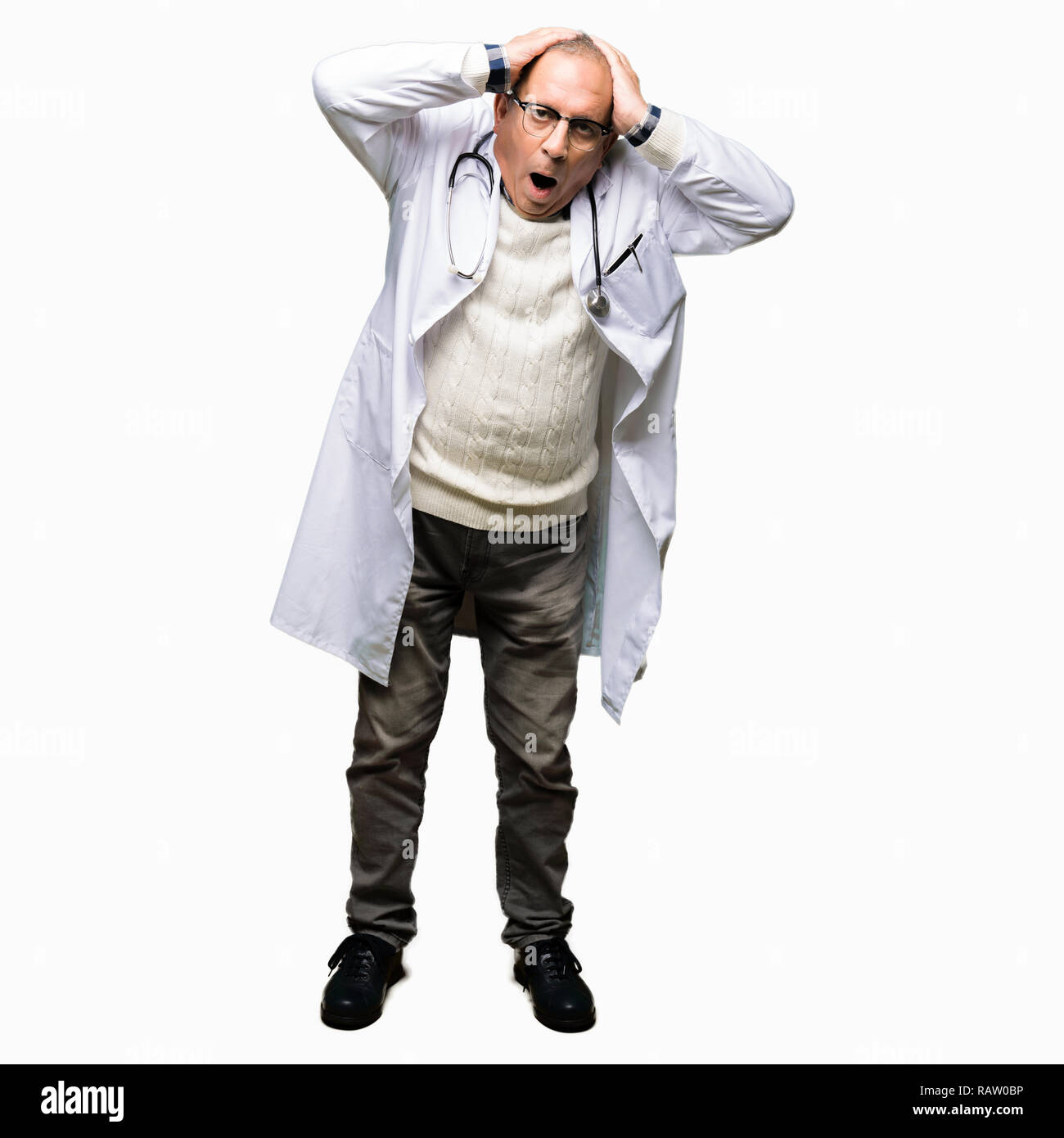 Handsome senior doctor man wearing medical coat Crazy and scared with ...