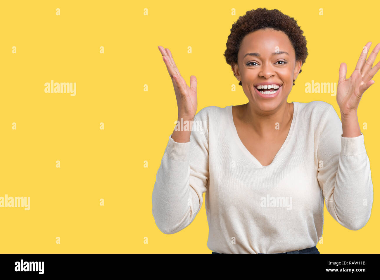 Young african american woman over isolated background celebrating crazy ...