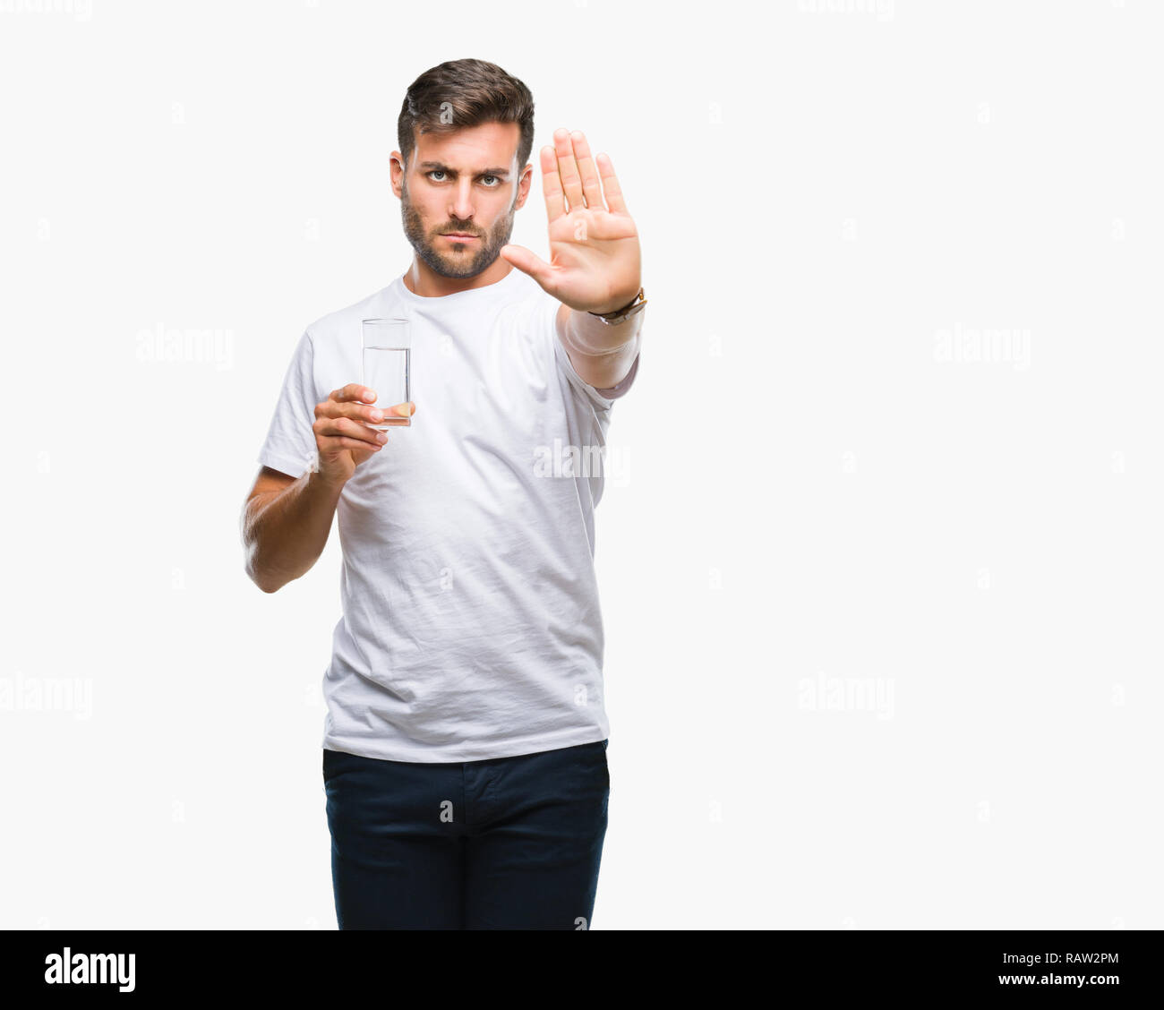 Young handsome man drinking glass of water over isolated background ...