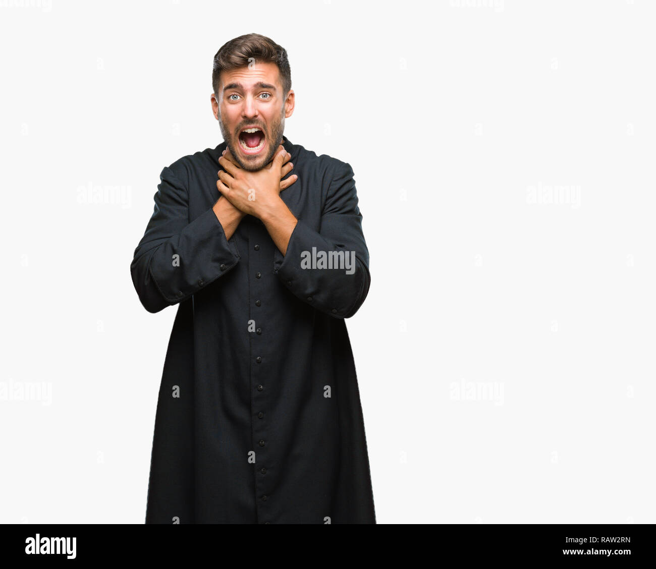 Young catholic christian priest man over isolated background shouting ...