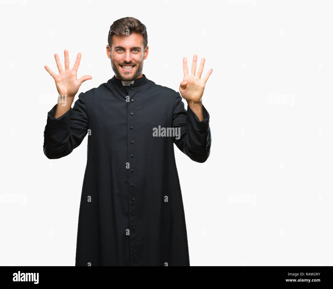 Young catholic christian priest man over isolated background showing ...