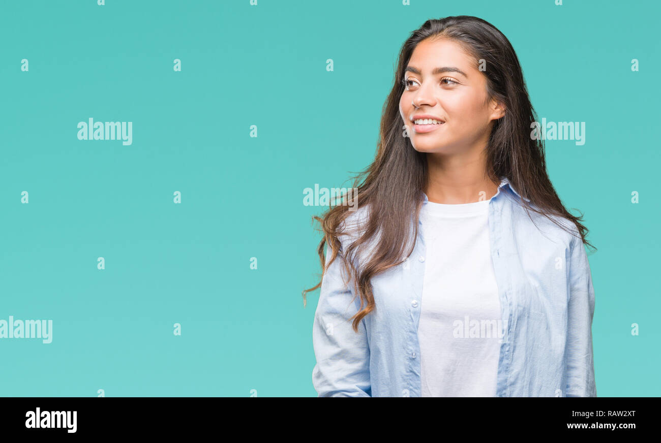 Young beautiful arab woman over isolated background looking away to ...