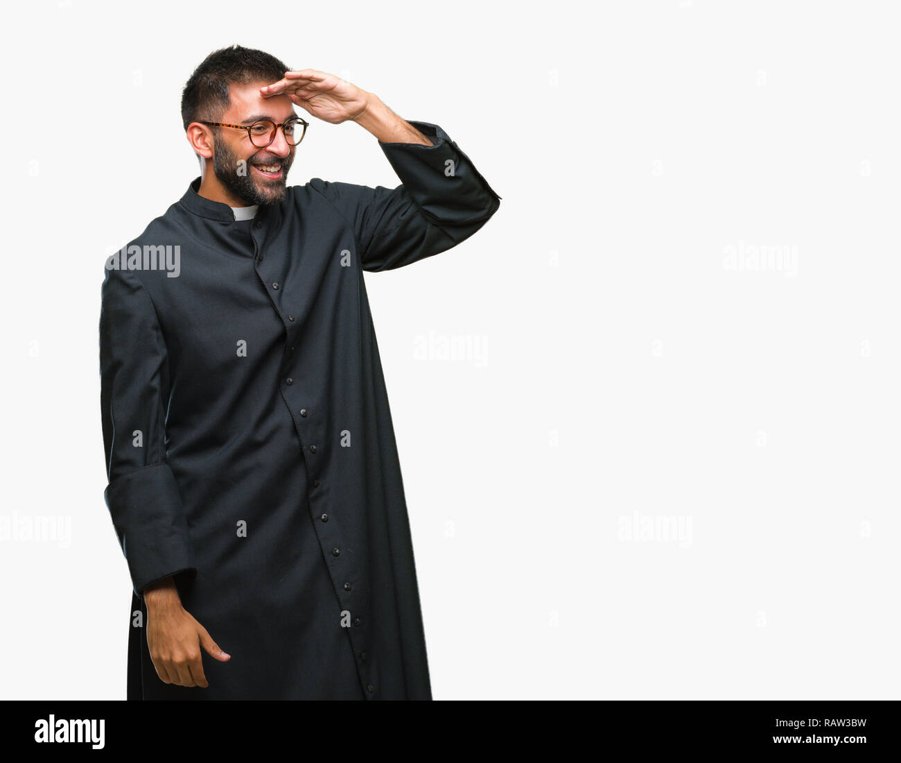 Adult hispanic catholic priest man over isolated background very happy ...